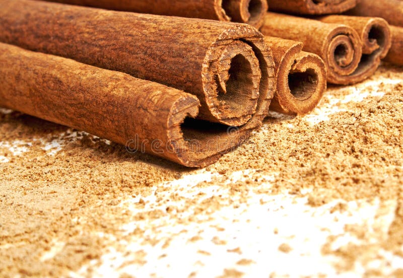 Cinnamon Dust and Sticks in Cup with Cinnamon Leaves Stock Photo ...