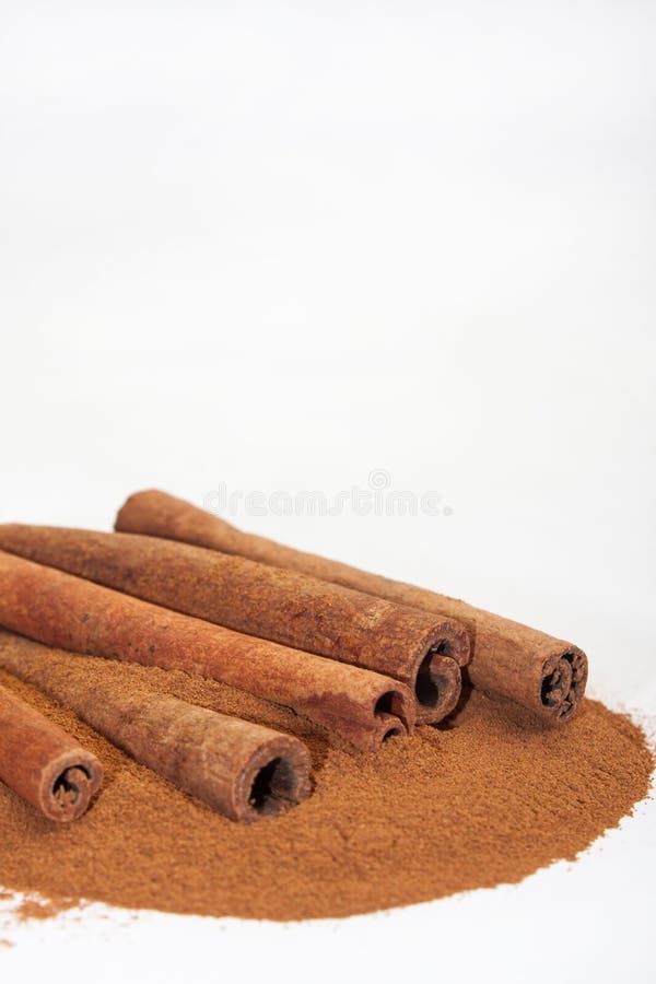 Cinnamon Sticks in a Pile of Ground Cinnamon Stock Image - Image of ...