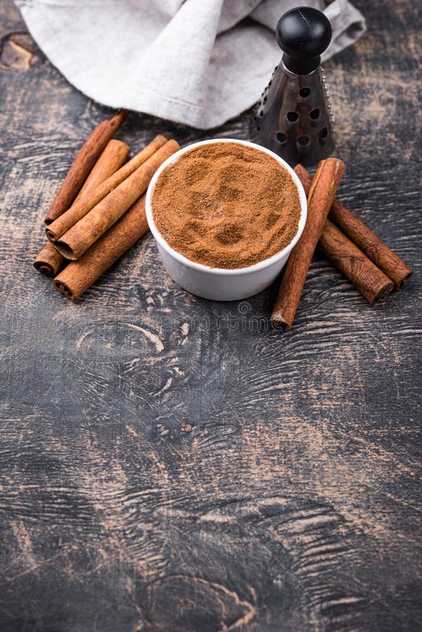 Cinnamon Sticks and Powder on Black Stock Photo - Image of food, detox ...