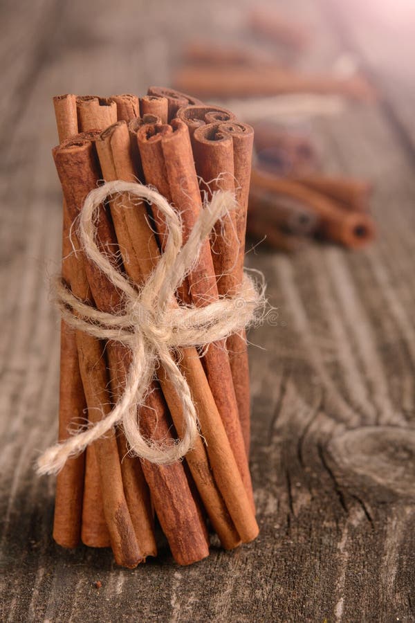 Cinnamon Sticks Tied with a Rope on a Wooden Background â€“ Image Stock ...