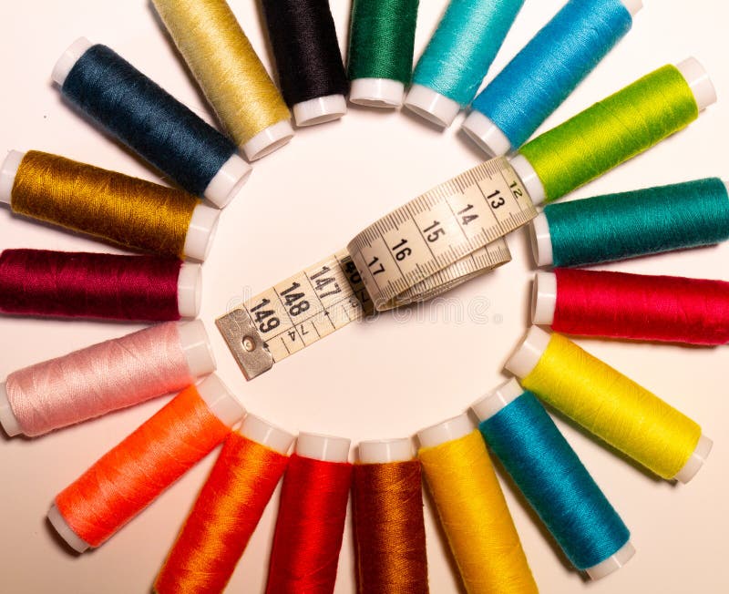 Circle of Color Sewing Threads on White Background with a Measuring ...