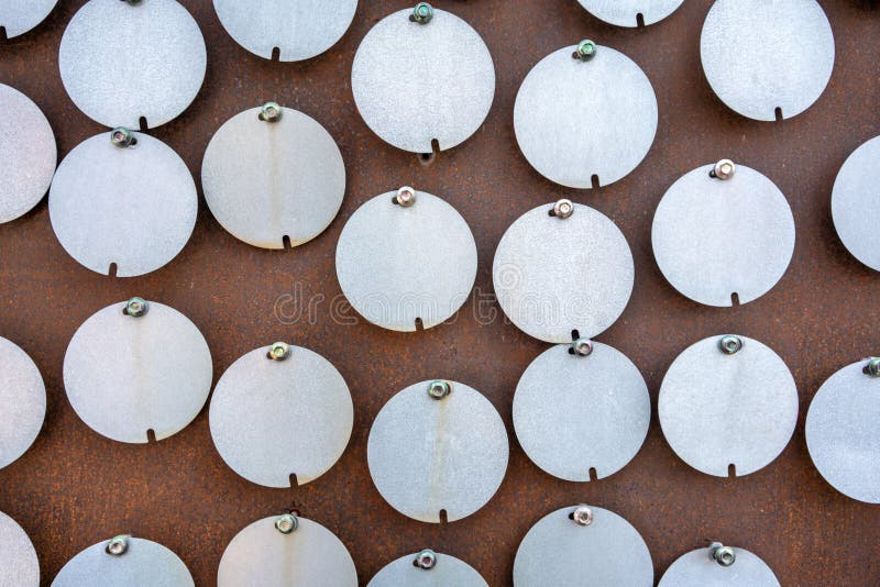 Circle Metal Sheets Installed on Rusty Metal Wall for Decoration Stock ...