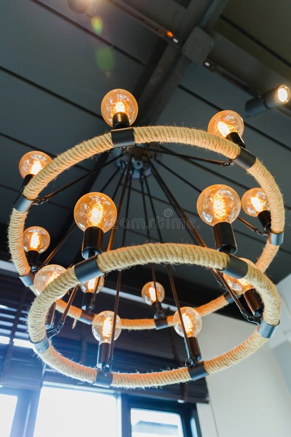 Circle Orange Light Bulb, Hanging on the Ceiling with Dark Background ...