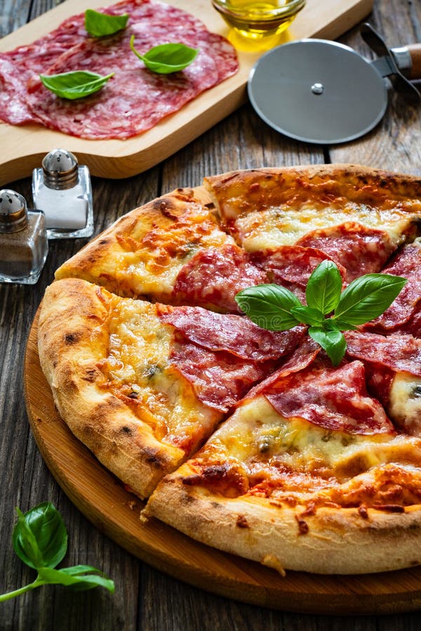 Circle Pepperoni Pizza with Mozzarella Cheese on Wooden Table Stock ...