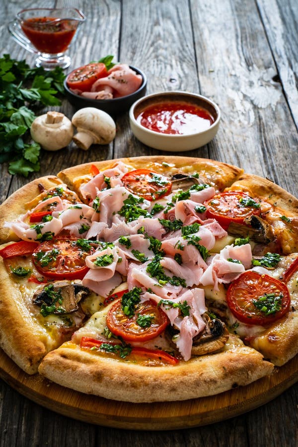 Circle Pizza with Boiled Ham Tomatoes and Mushrooms on Wooden Table ...