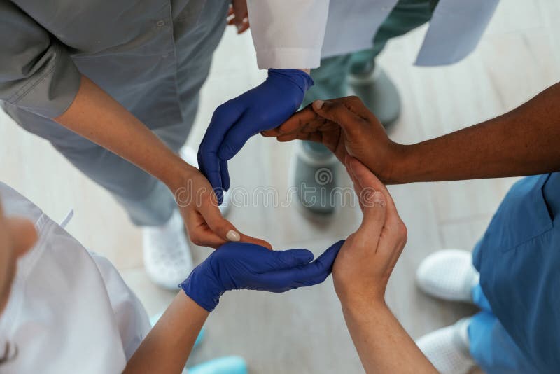 Circle Shaped Gesture. Group of Doctors are Holding Hands in Trust ...