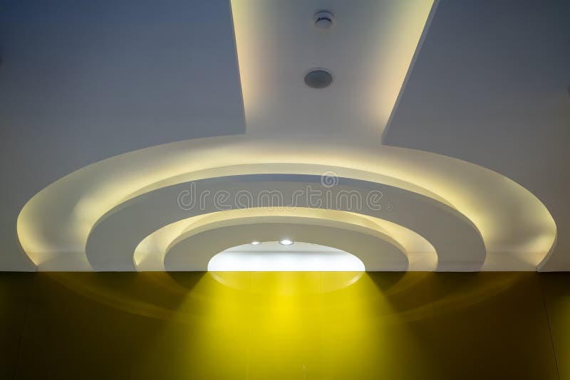 Circle Shapes Ceiling with Lighting Against Yellow Wall. Interior ...