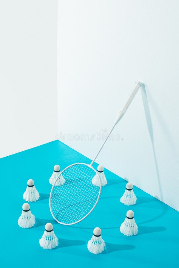Circle of Shuttlecocks Around Badminton Racket on Blue Stock Image ...