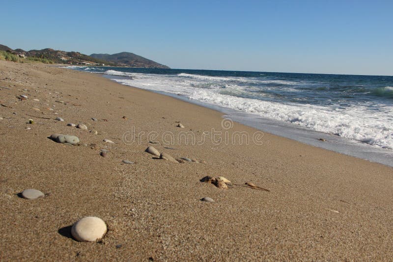 Circle Stone on the Beach, Blue Sea and Waves Stock Image - Image of ...