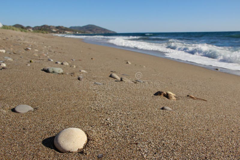 Circle Stone on the Beach, Blue Sea and Waves Stock Photo - Image of ...