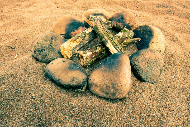 Circle of Stones with Firewoods for the Bonfire on the Beach. Stock ...