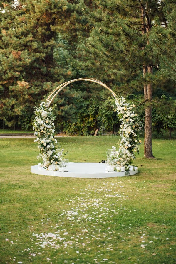 Circle Wedding Arch Decorated with White Flowers and Greenery Outdoors ...