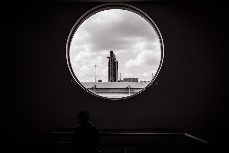 Circle Window with a Building and Sky in Frame. Black and White Photo ...