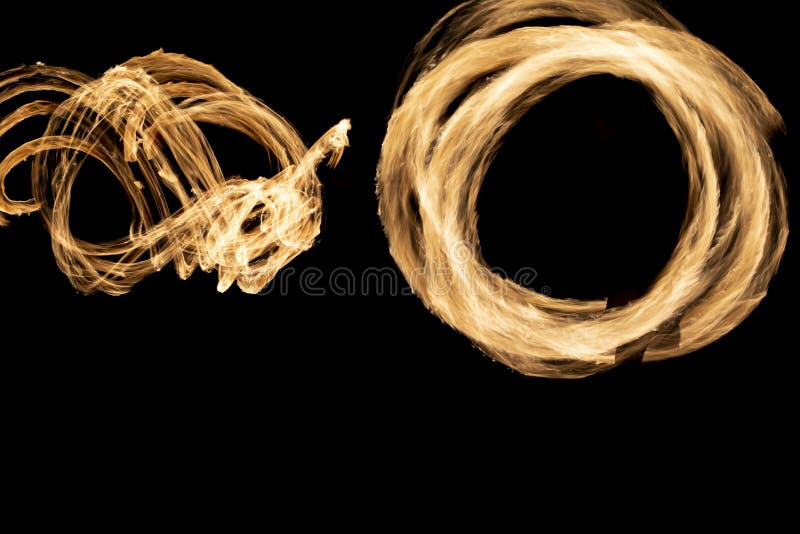 Circles of Flames in Dark. Fire Show on Long Camera Shutter Speed Stock ...