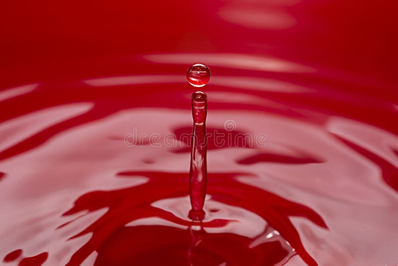 Circles on the Water from a Falling Drop of Water. Red Abstract ...