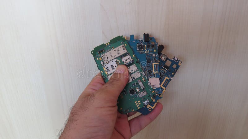 Circuit boards in hand stock photo. Image of motherboard - 122692786