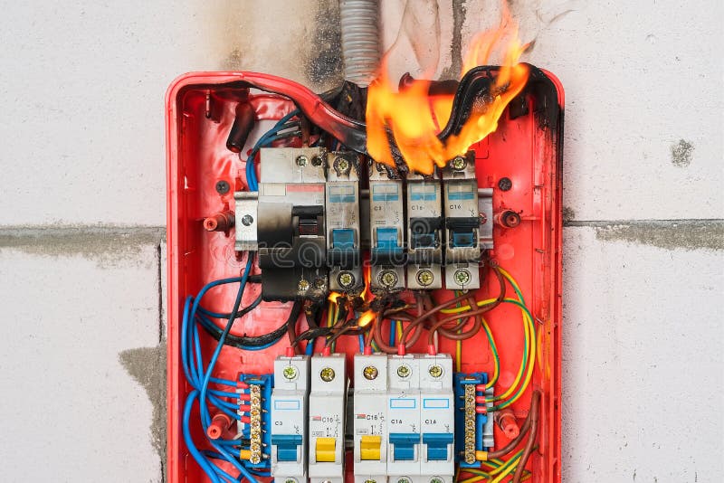 Burning Switchboard from Overload or Short Circuit on Wall Closeup ...