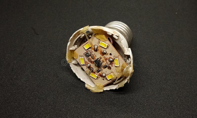 The Circuit Inside the Broken White LED Lamp, Isolated on Black ...