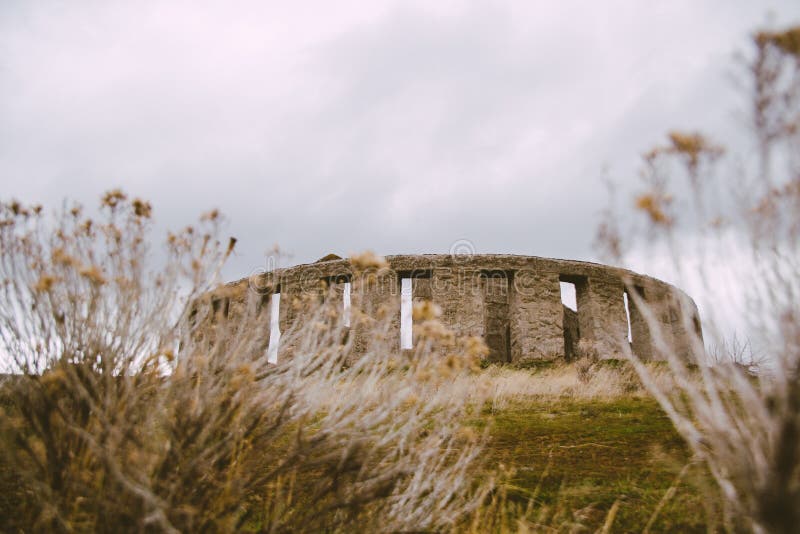 Circular Ancient Building Made Out of Stone Surrounded by Grass Stock ...
