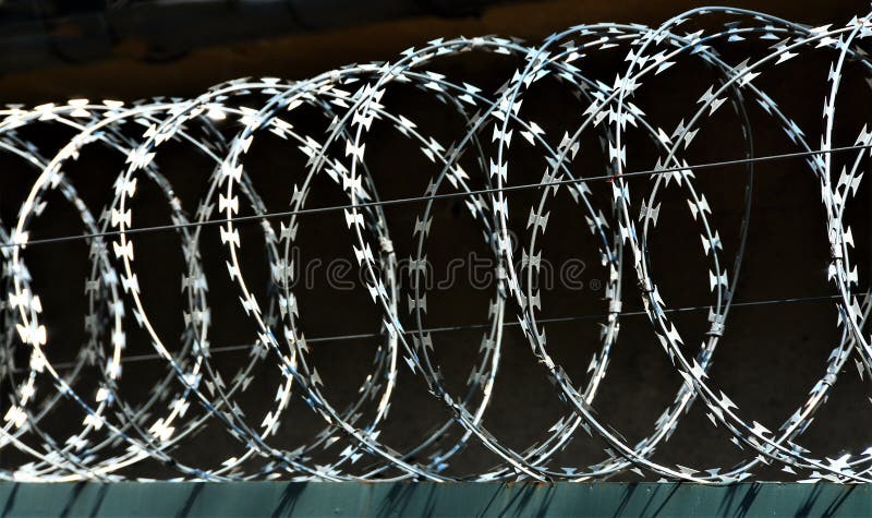 Circular Barbed Wire on a Dark Background Stock Photo - Image of dark ...