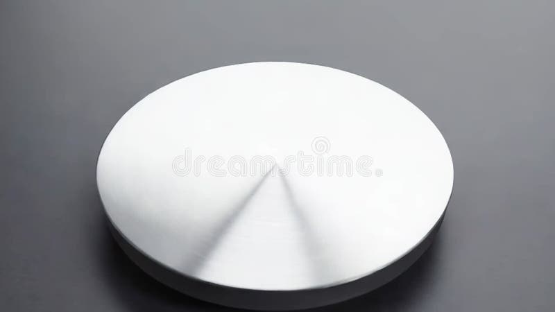 Brushed Metal Disk Shining on a Gray Background Stock Video - Video of ...