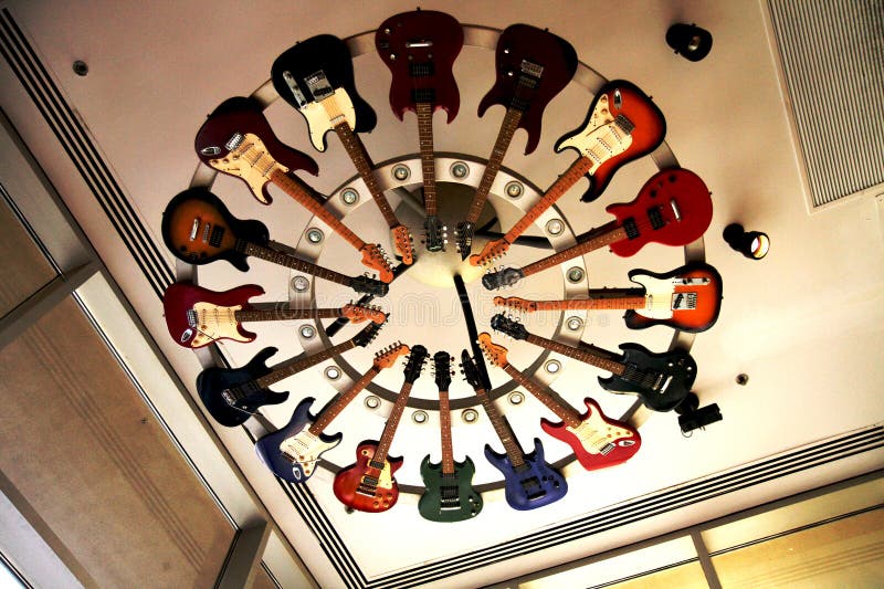 A Round Ceiling Installation Made of Multi-colored Electric Guitars ...