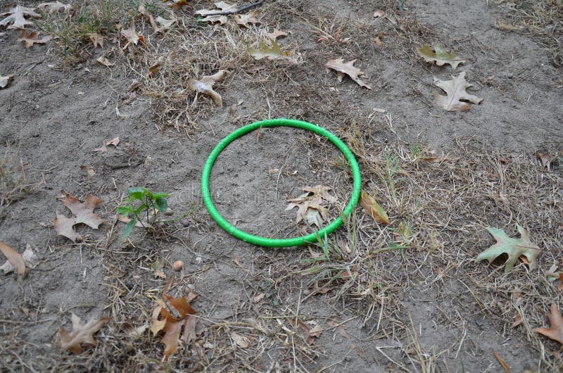 Circular Green Plastic Ring in Brown Grass or Lawn and Dirt Stock Photo ...