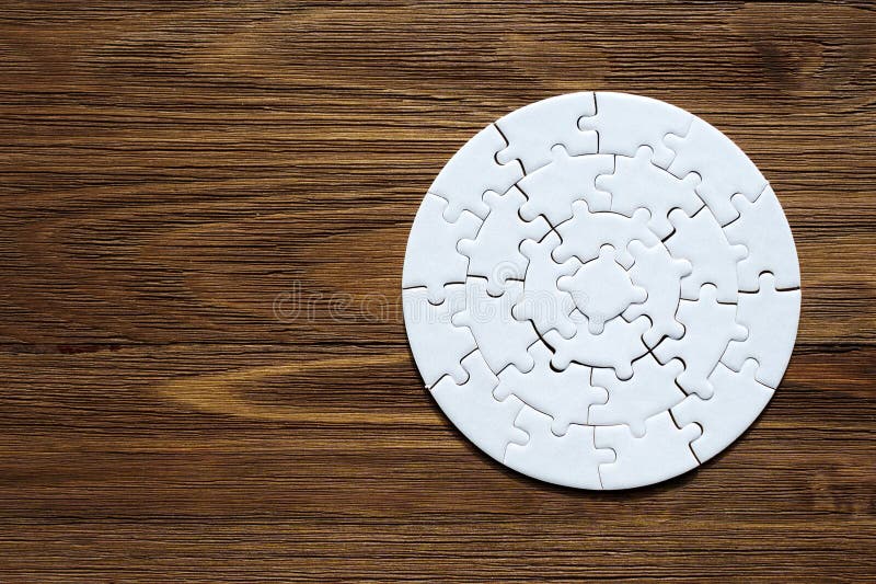 Circular Jigsaw Puzzle on a Wooden Table Stock Image - Image of pieces ...