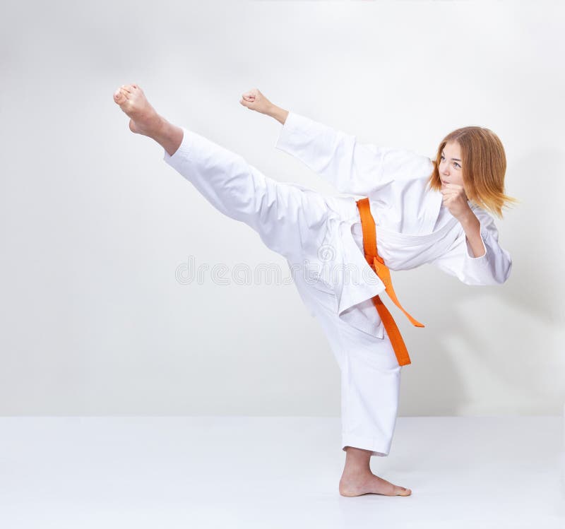 A Circular Kick is Training by a Girl in Karategi Stock Photo - Image ...