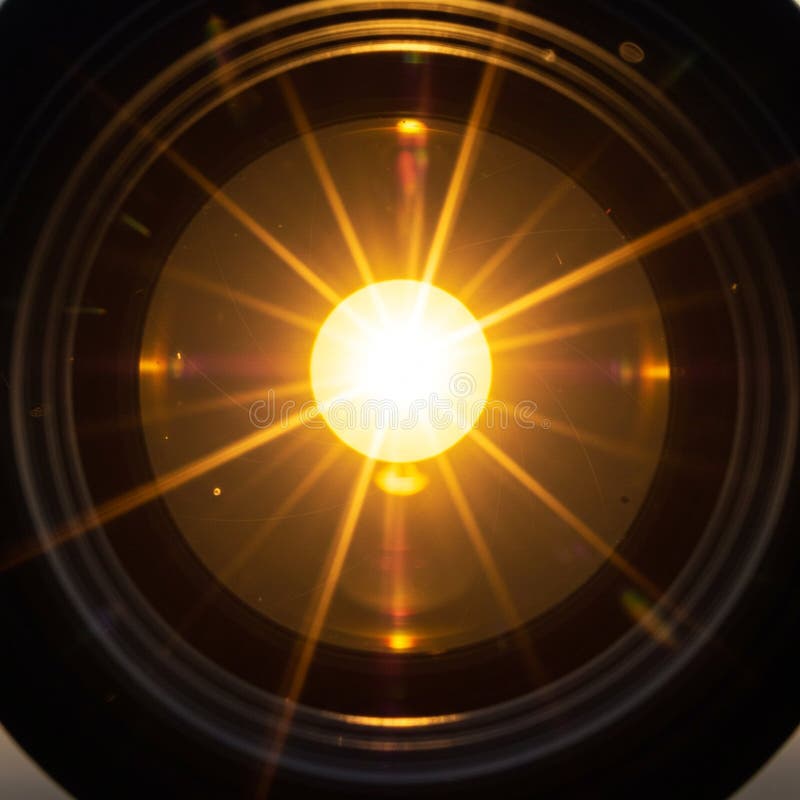 Circular Lens with a Bright, Central Light Source Emitting Golden ...