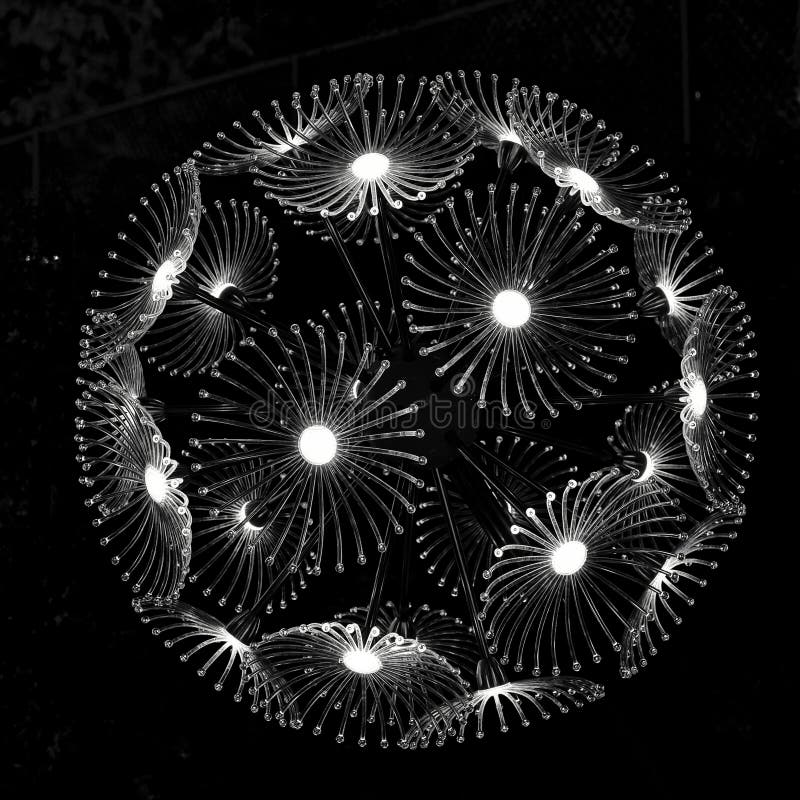 A Circular Light with a Circle of Fireworks on it, on a Black ...