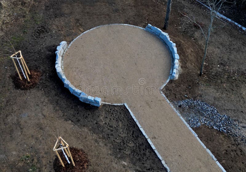 Circular Rest Stop with an Obelisk at the End of Path in the Park ...