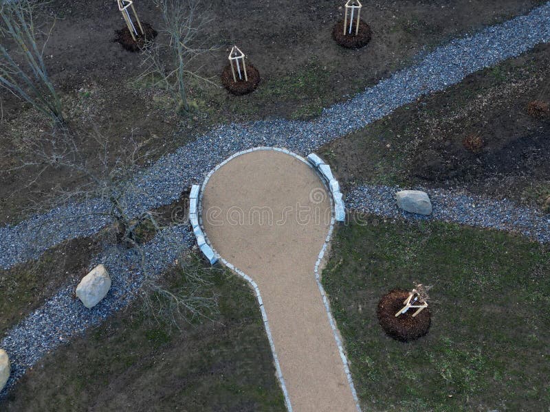 Circular Rest Stop with an Obelisk at the End of Path in the Park ...