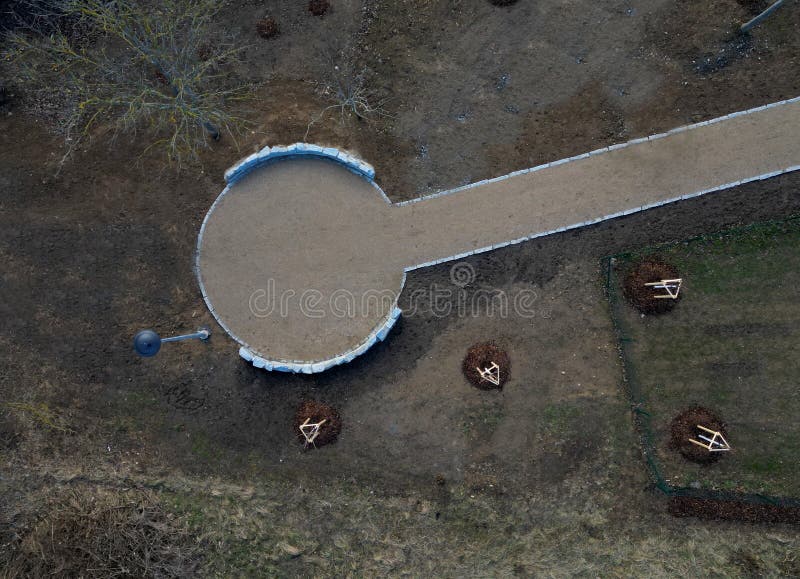 Circular Rest Stop with an Obelisk at the End of Path in the Park ...
