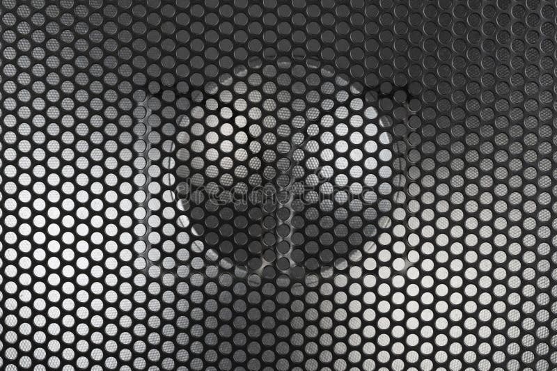 Close-up View of Circular Speaker Behind Perforated Mesh in Modern ...