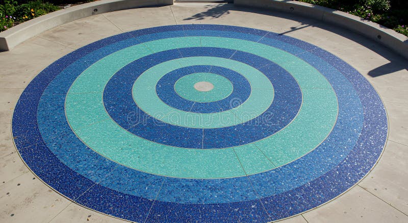 Circular Tile Design on Concrete Ground with Blue and Green Concentric ...