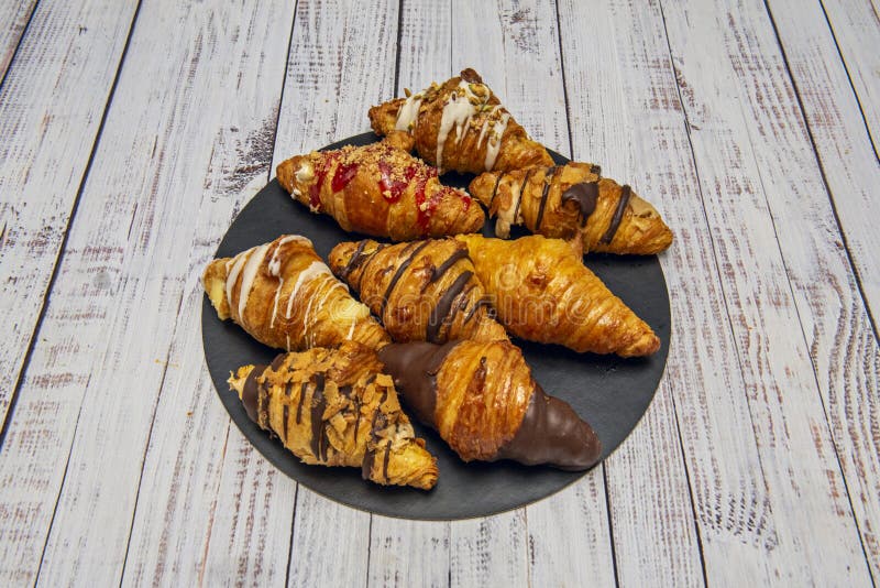 A Circular Tray with Mini Croissants Filled with Chocolate in Various ...