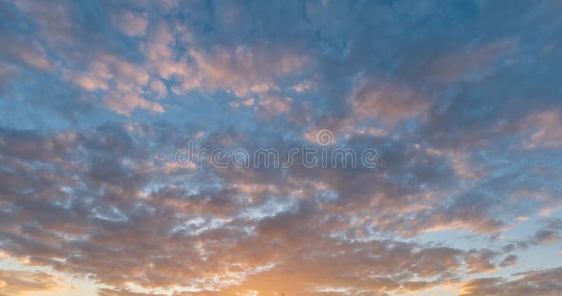 Cirrus Clouds Movement during Sunset. Sky in Subtle Shades of Orange ...