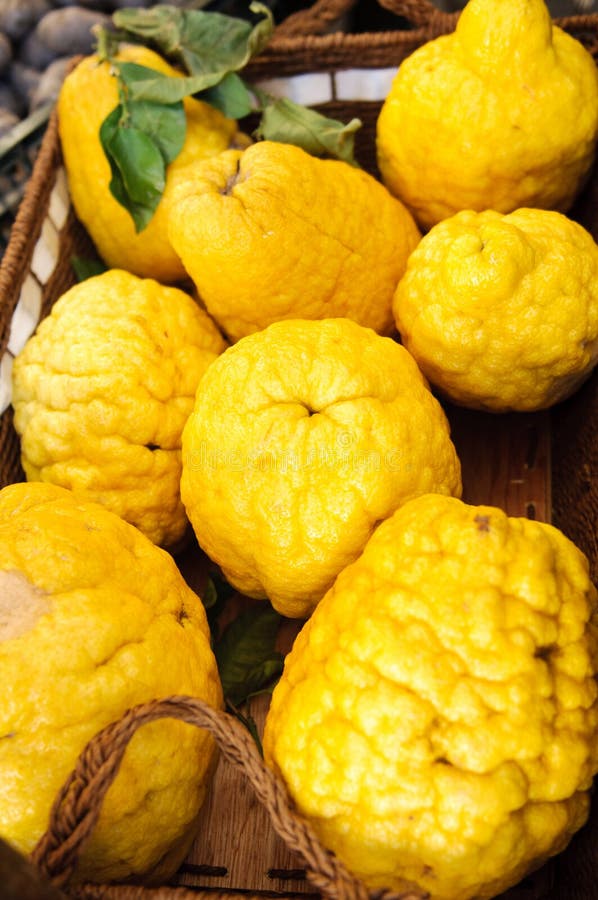 Citrons in a wooden box stock photo. Image of leaves - 23501244