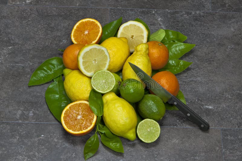 Citrus fruits with knife stock image. Image of green - 19407389