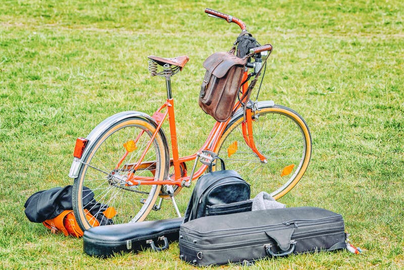 City Bicycle and Boxes for Musical Instruments on Green Lawn Stock ...