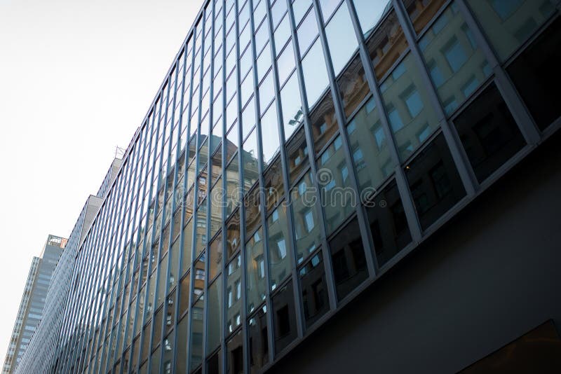 City Buildings Reflecting Off of Another Office Building Windows Stock ...