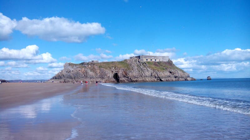 A City Built on Cliffs by the Sea and a Beach on the Shore Stock Image ...