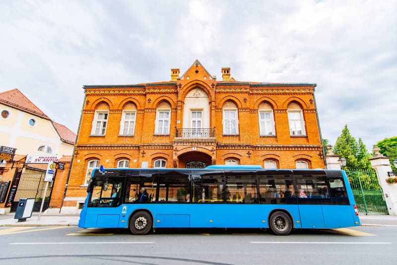 City Bus Station with Blue Bus Editorial Photography - Image of wide ...