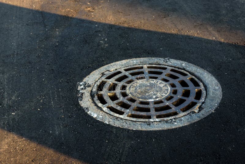 City Canal Hatch/cover on the Asphalt Road Stock Image - Image of road ...