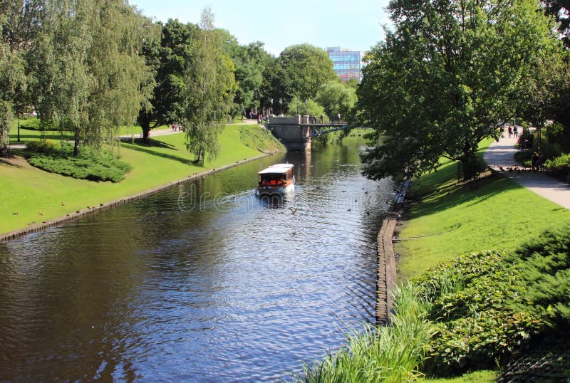 The city channel in Riga stock image. Image of trees - 30940429