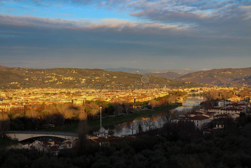 City Covered in Buildings Surrounded by the River and Hills Under a ...