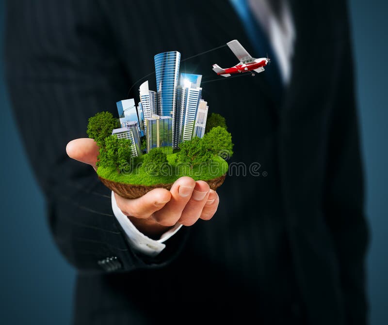 City in hand stock photo. Image of businessman, grass - 26525504