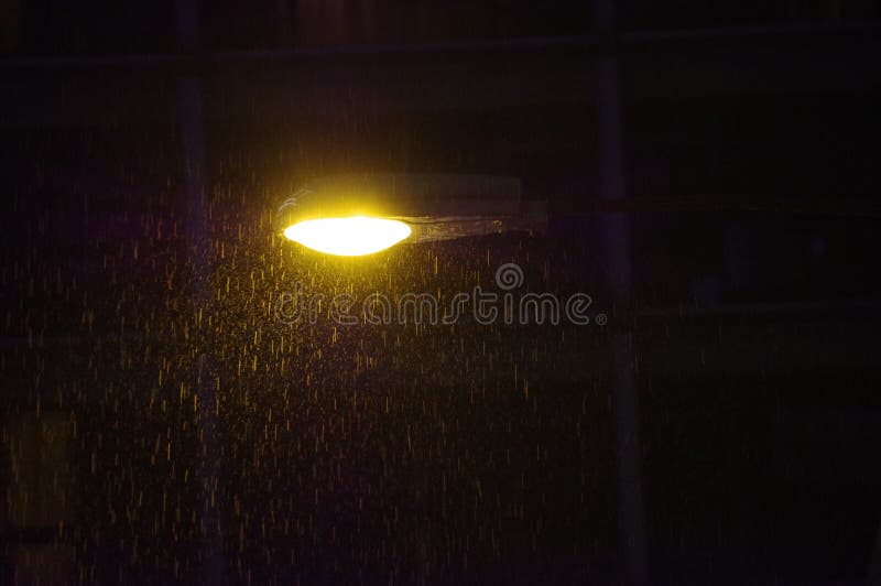 City lamp post in rain stock photo. Image of yellow - 237511440