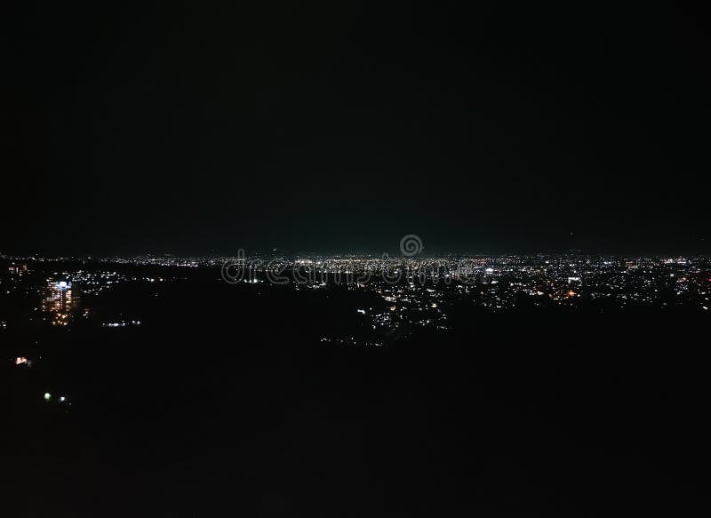 City Lights Against a Dark Sky at Night. Stock Image - Image of city ...